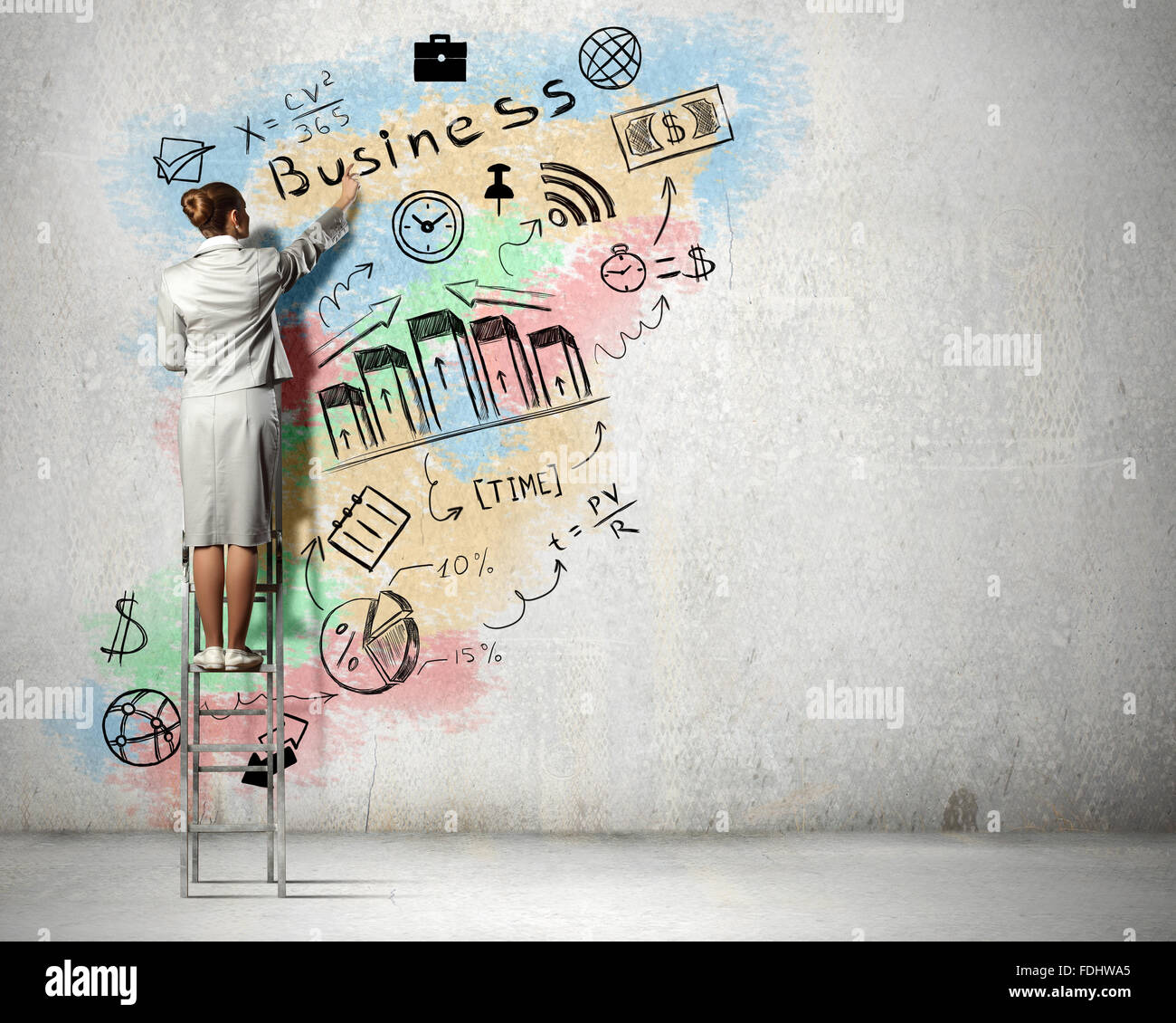 Back view of businesswoman standing on ladder and drawing sketch on ...