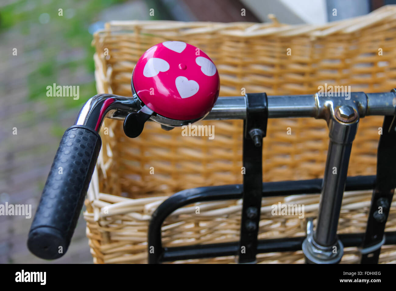 Pink bicycle bell with white hearts on handlebars Stock Photo - Alamy