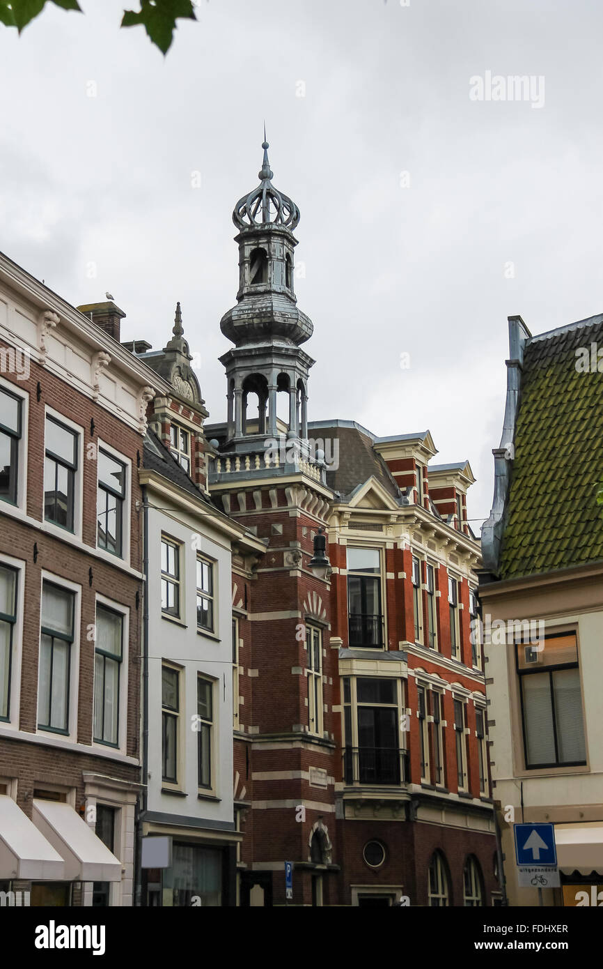 Old tower with a spire in the historic center of Haarlem, the ...