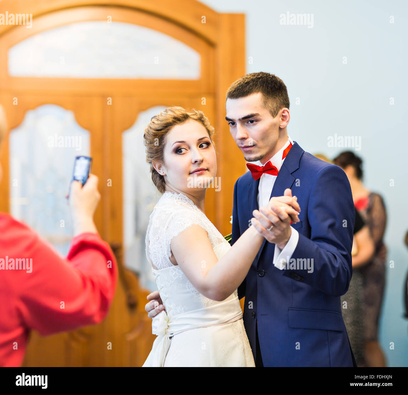 Guest Taking Photo Of Wedding Party Stock Photo - Alamy