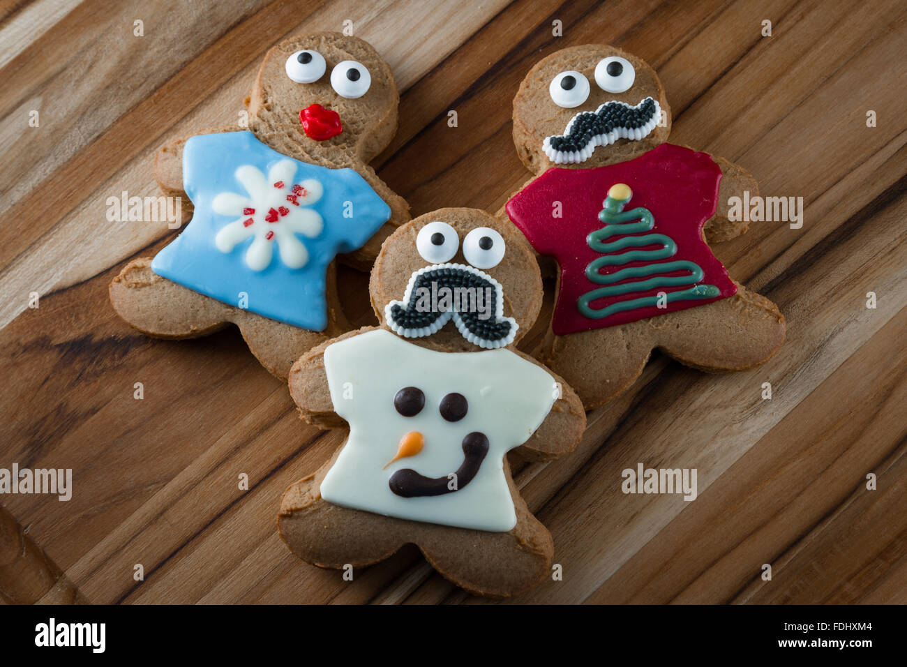 funny gingerbread cookies wearing ugly holiday sweaters and eyes and a ...