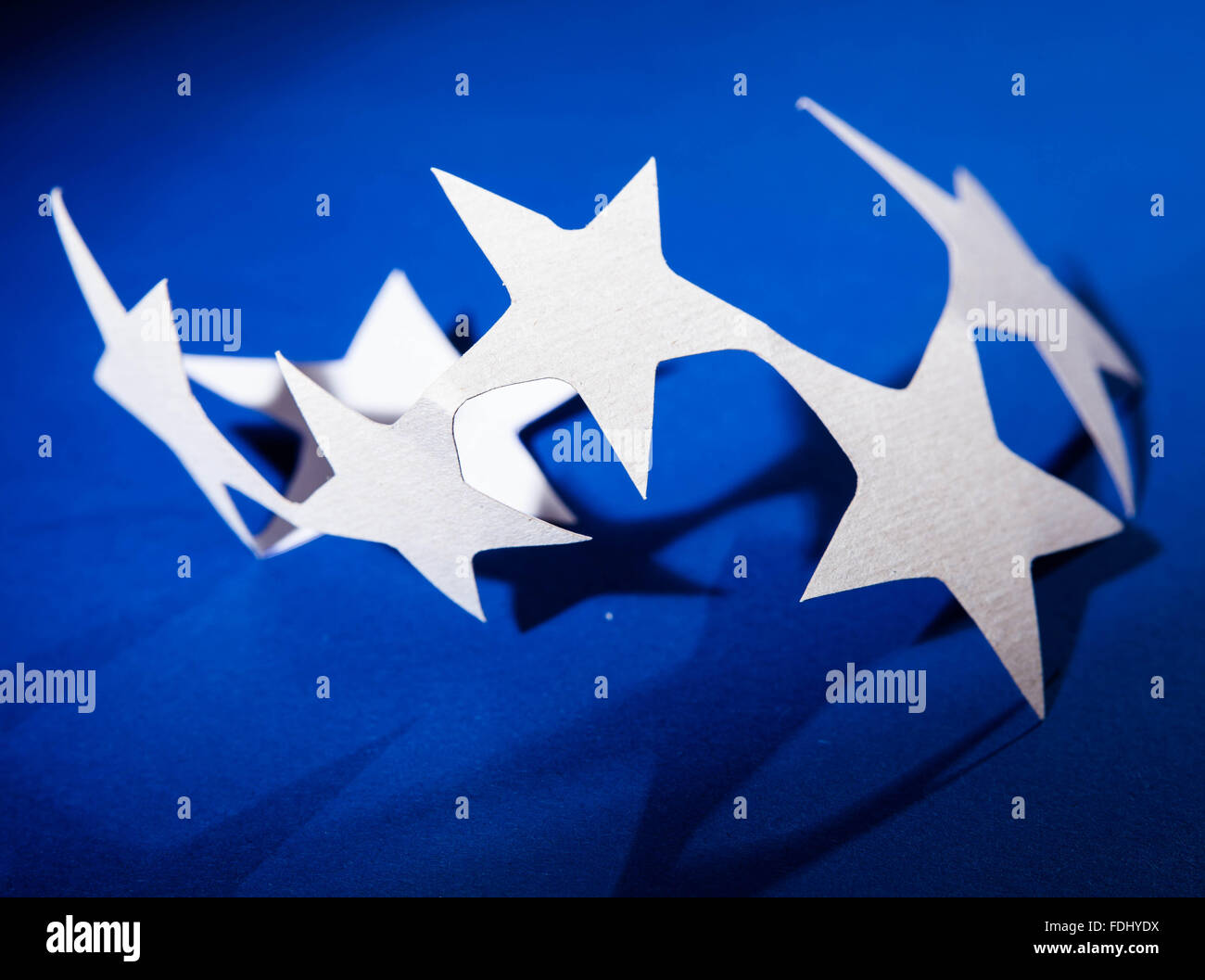 Paper stars group on a colour background Stock Photo - Alamy