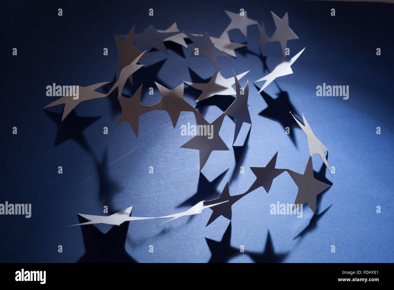 Paper stars group on a colour background Stock Photo - Alamy