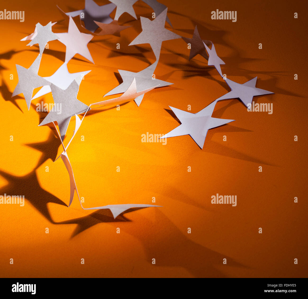 Paper stars group on a colour background Stock Photo - Alamy