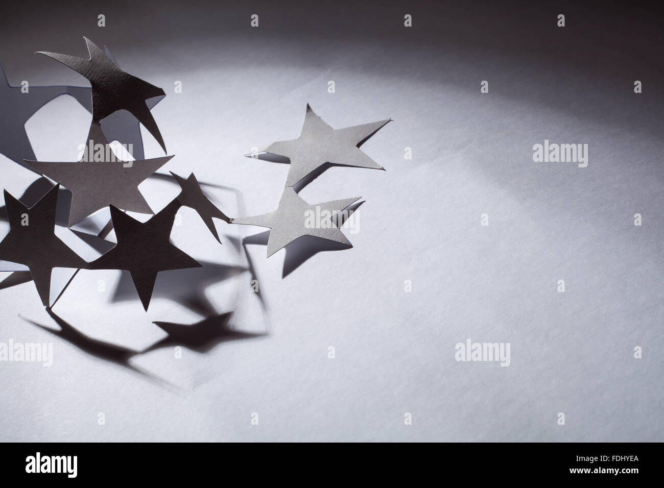 Paper stars group on a colour background Stock Photo - Alamy
