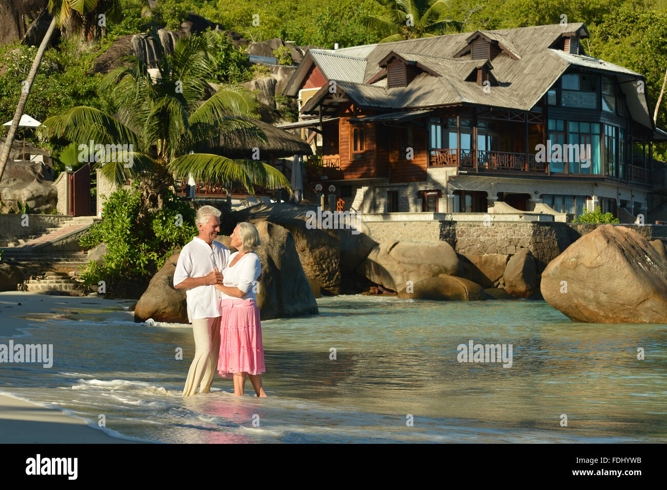 elderly couple rest at tropical resort Stock Photo - Alamy