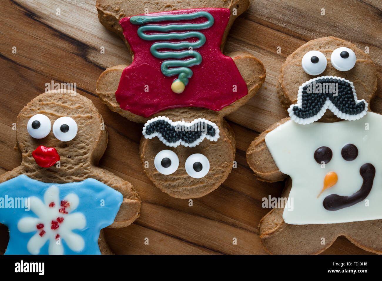 funny gingerbread cookies wearing ugly holiday sweaters and eyes and a ...