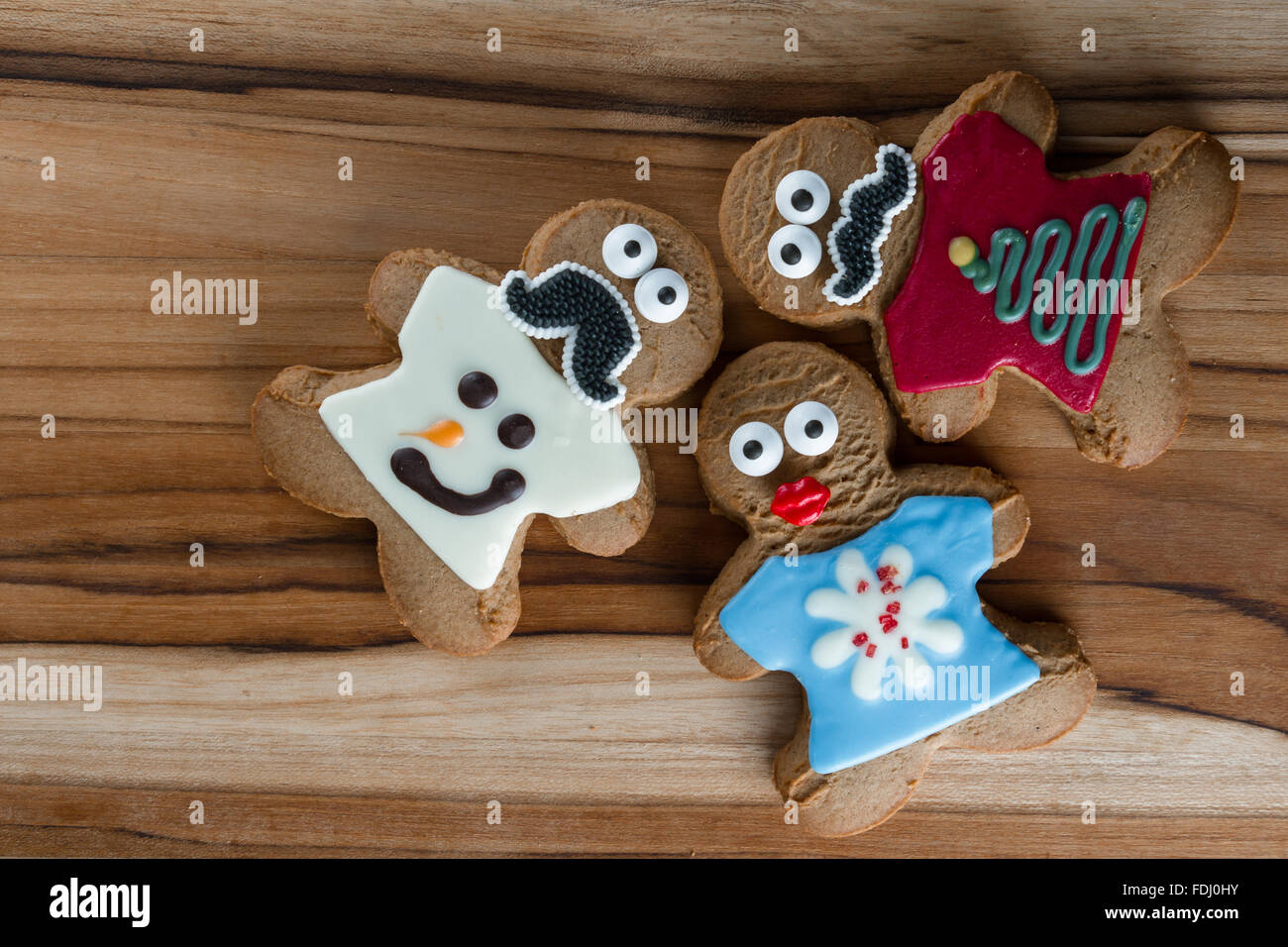 funny gingerbread cookies wearing ugly holiday sweaters and eyes and a ...