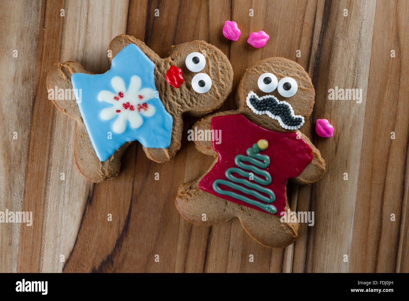 funny gingerbread cookies wearing ugly holiday sweaters and eyes and a ...