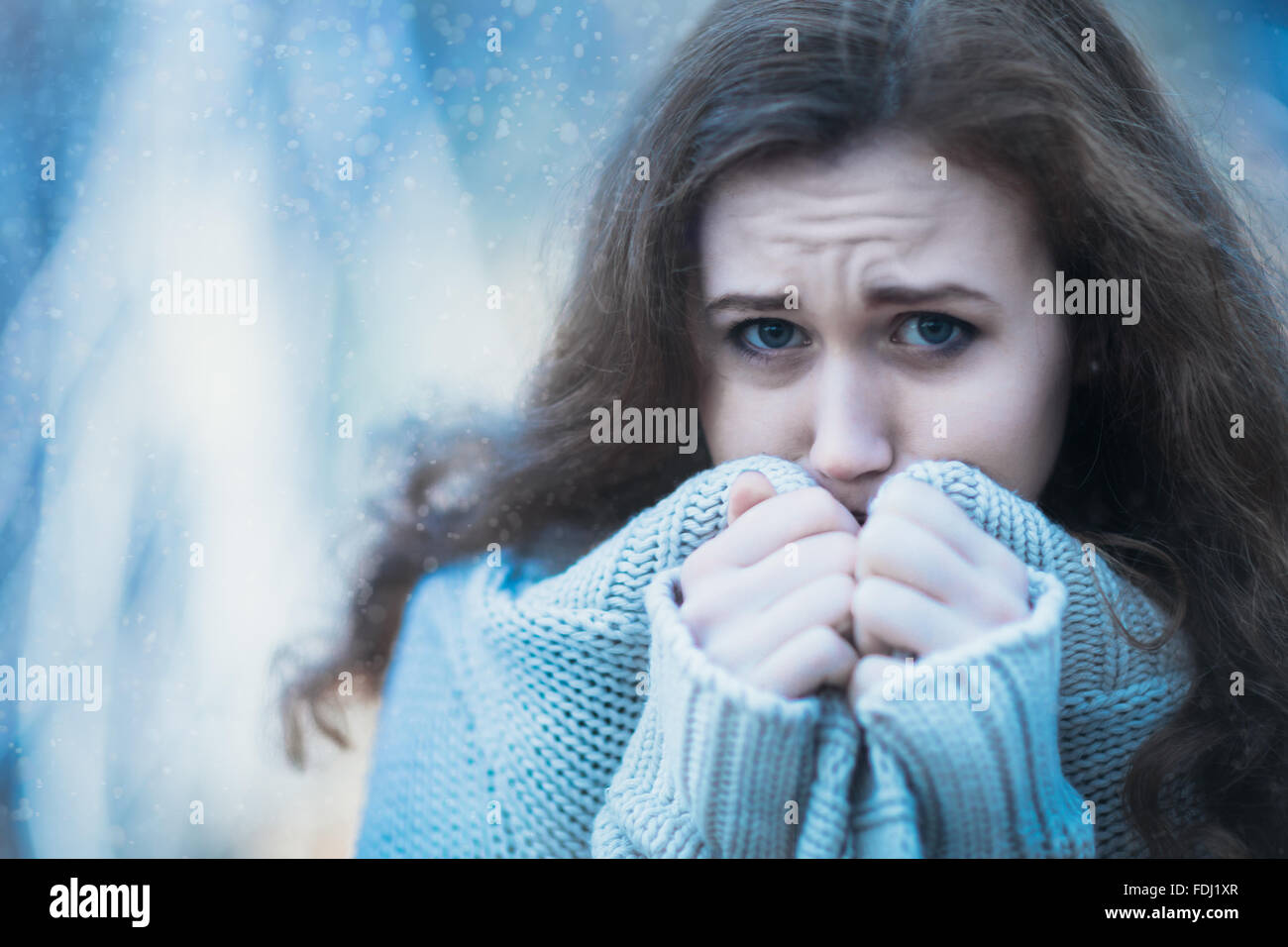 ill young girl on a cold winter background Stock Photo - Alamy