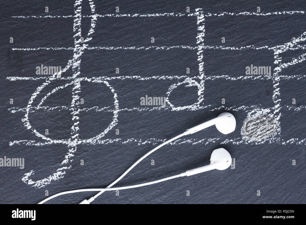 Music notes with headphones Stock Photo - Alamy