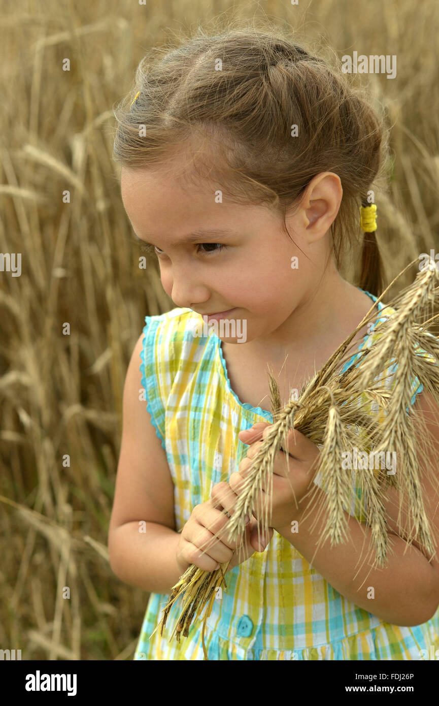 Cute girl in field Stock Photo - Alamy