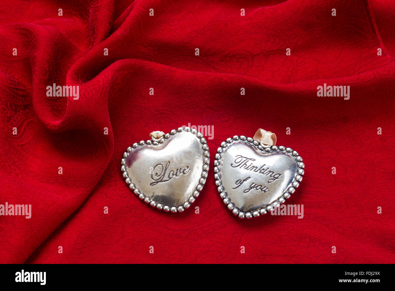 two hearts red background Stock Photo - Alamy