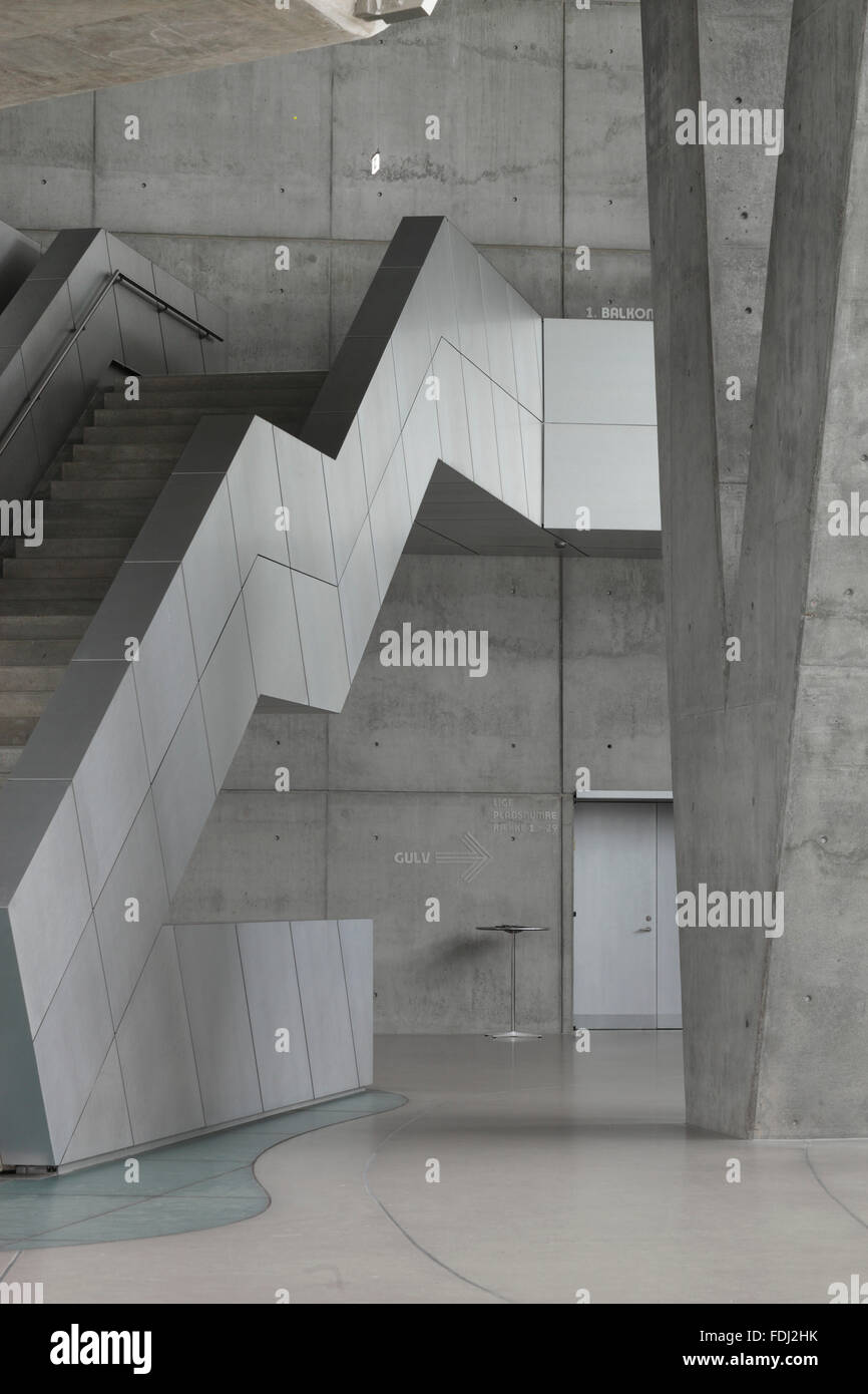 Detail of foyer with staircasea and V-shaped concrete columns ...