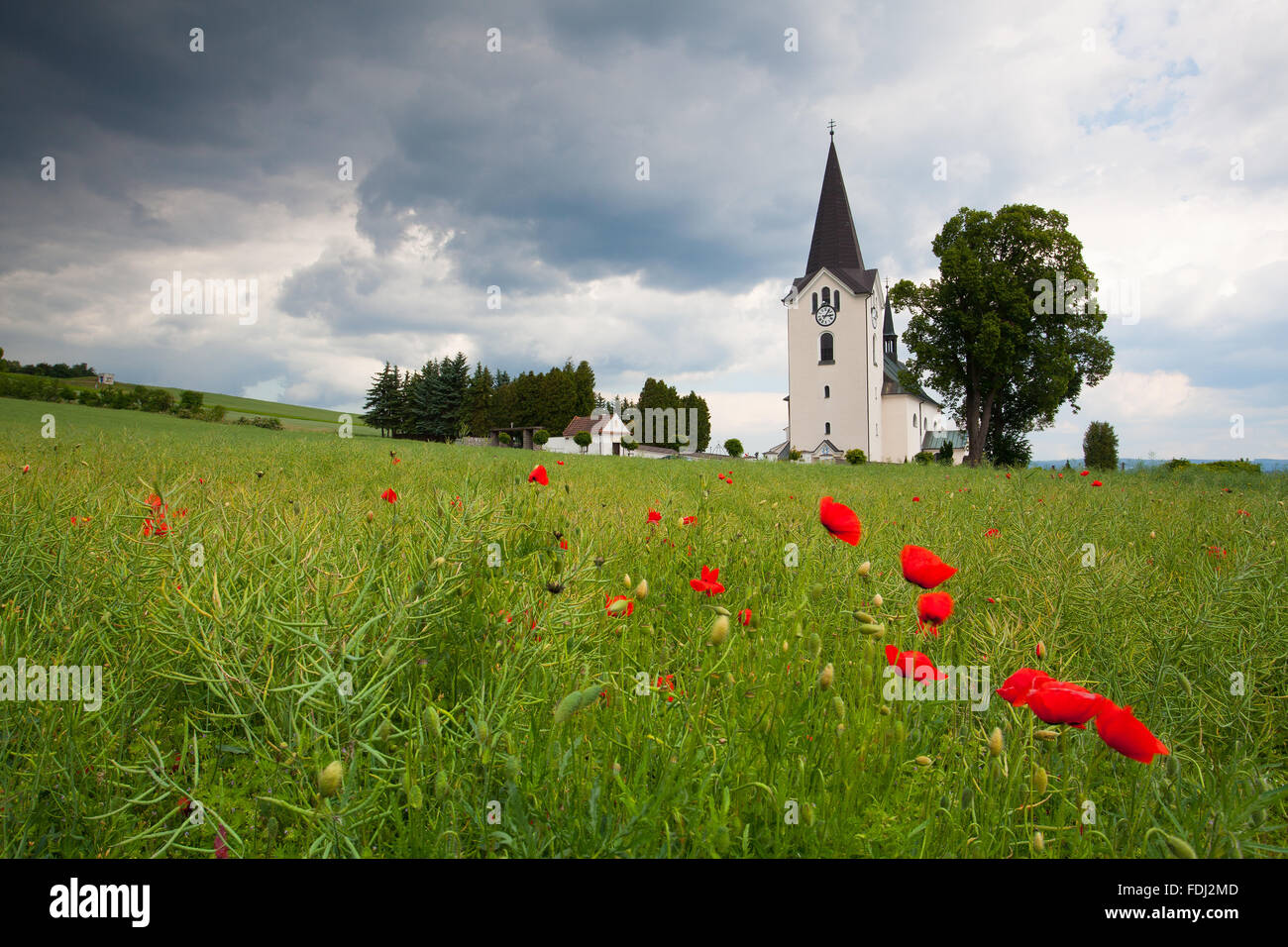 Lonely church in the middle poppy field before heavy storm Stock Photo ...