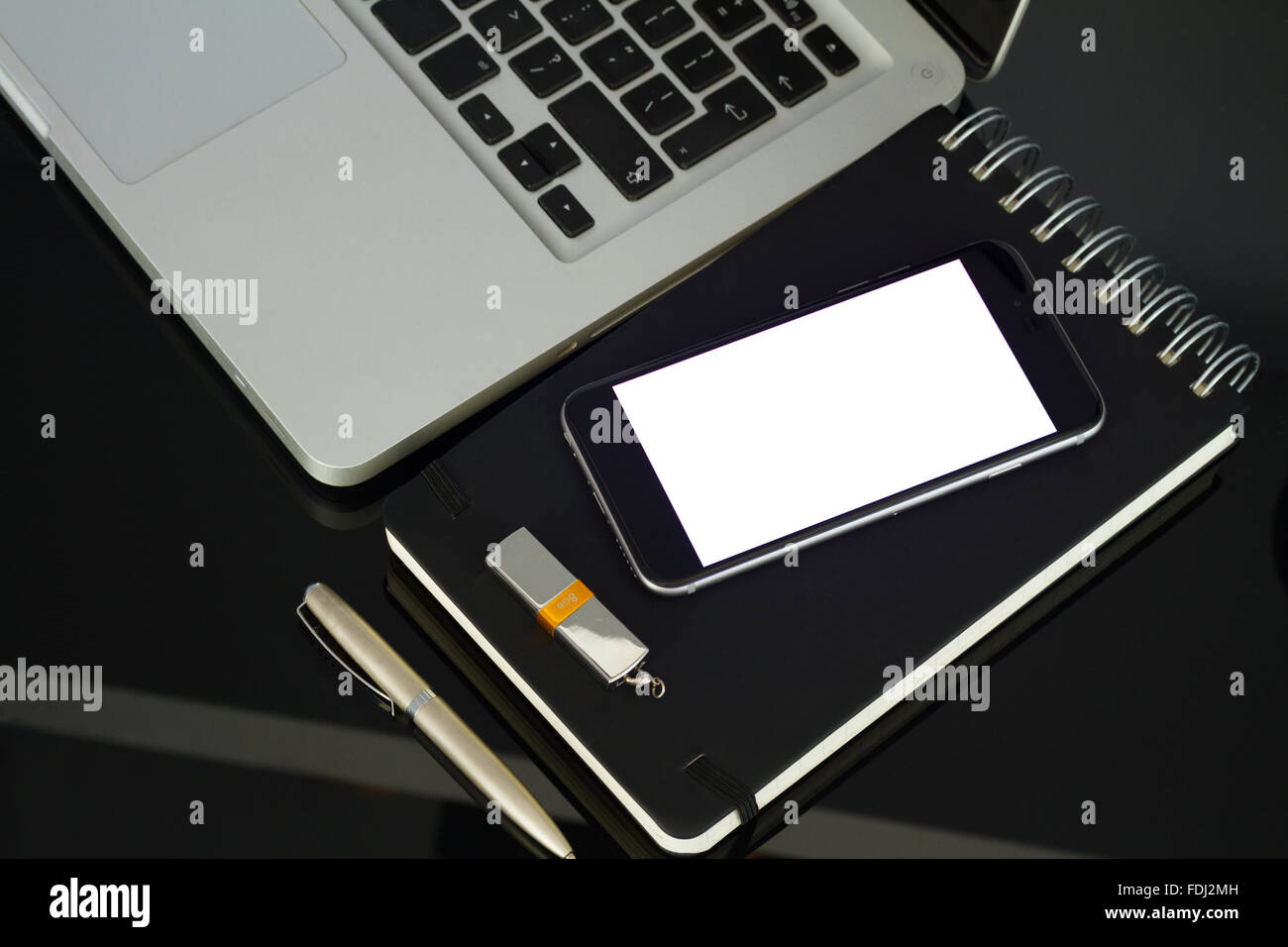 Office table with laptop, phone and supplies Stock Photo - Alamy
