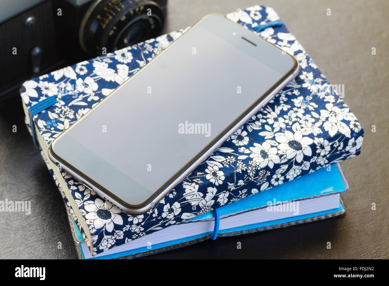 phone and notebooks Stock Photo - Alamy