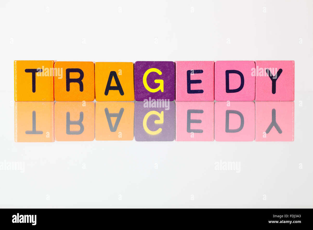 Tragedy - an inscription from children's wooden blocks Stock Photo - Alamy