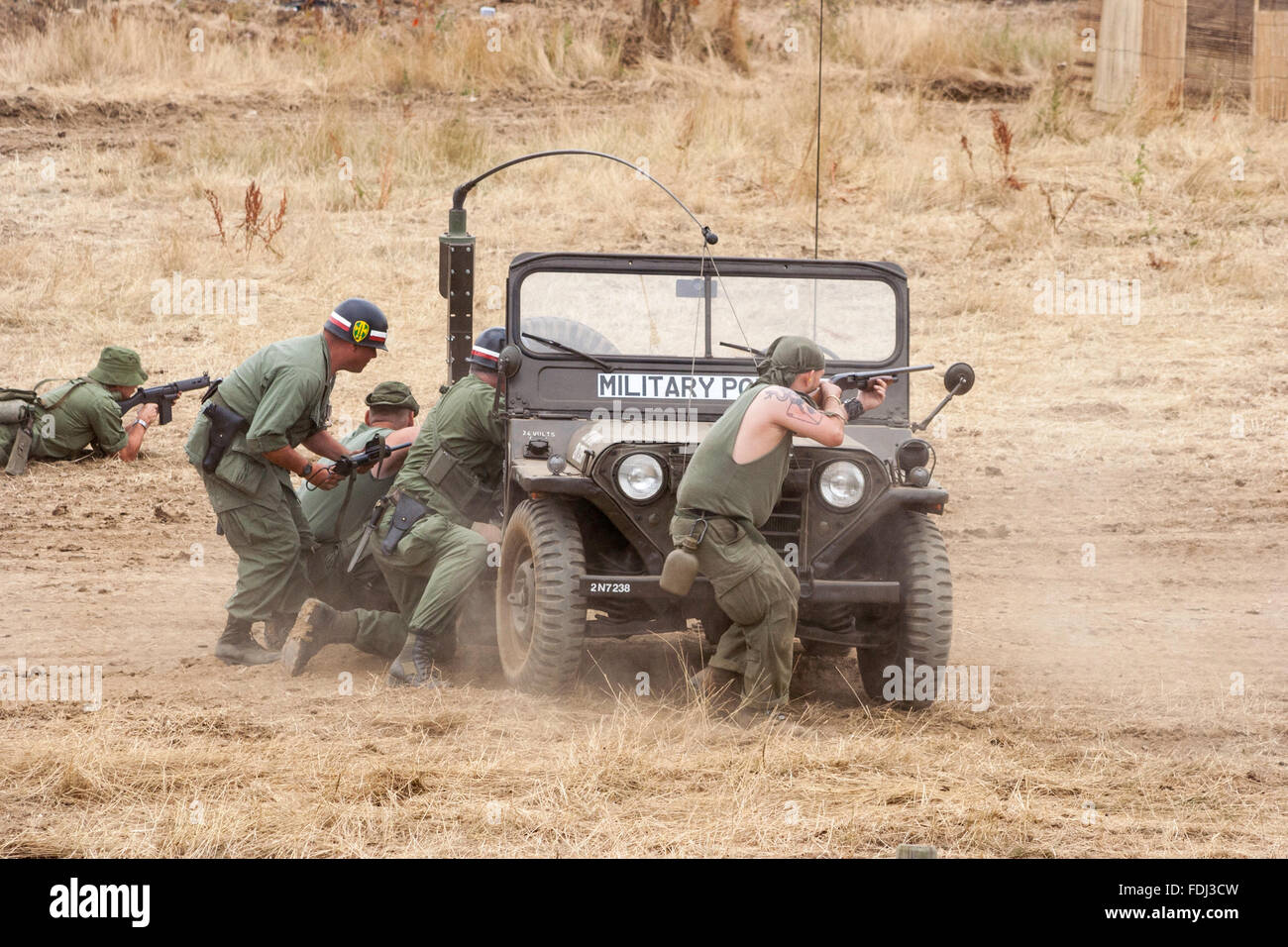 Vietnam war re-enactment. Mock battle. US American MPs, military Police ...