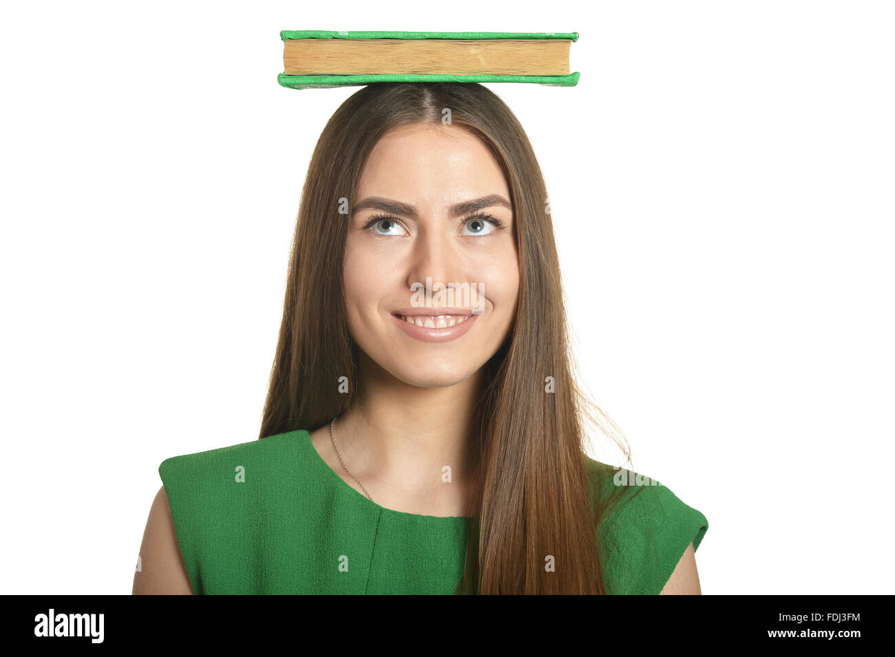 Woman with book on head Stock Photo - Alamy