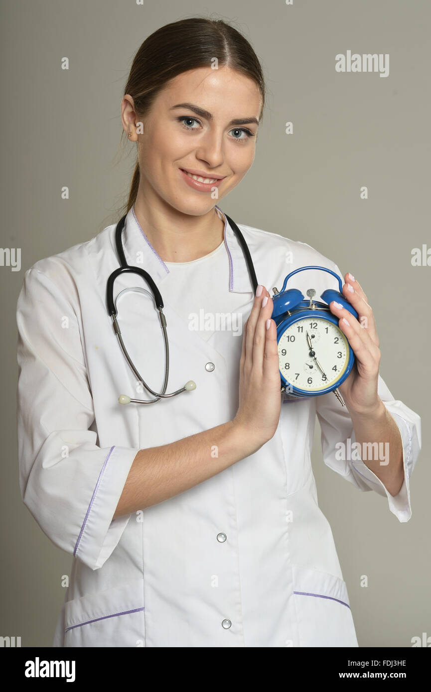 doctor with clock Stock Photo - Alamy
