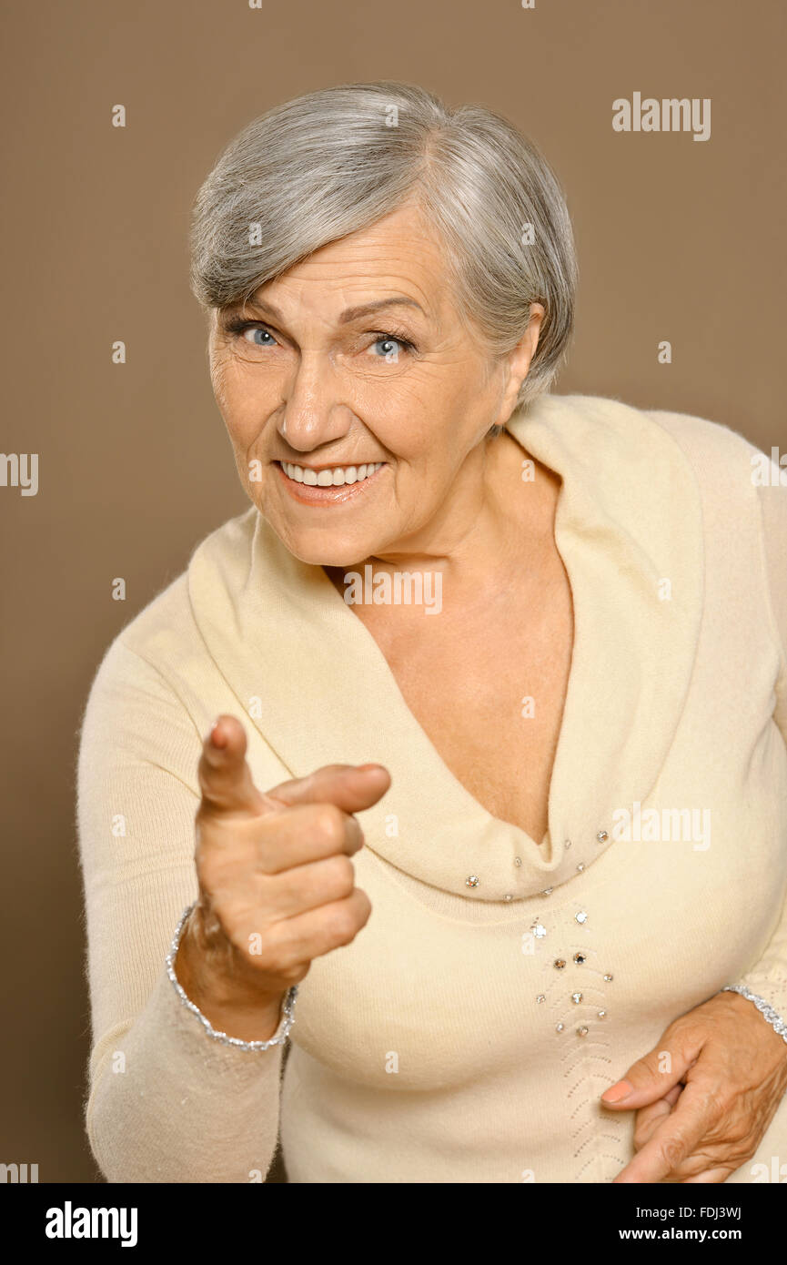 Senior woman pointing Stock Photo - Alamy