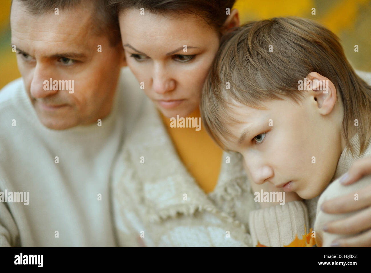 Portrait of a sad family Stock Photo - Alamy