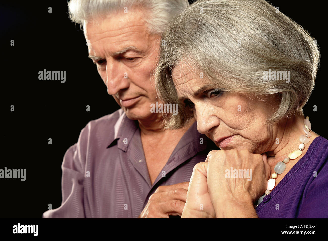 Sad elderly couple Stock Photo - Alamy