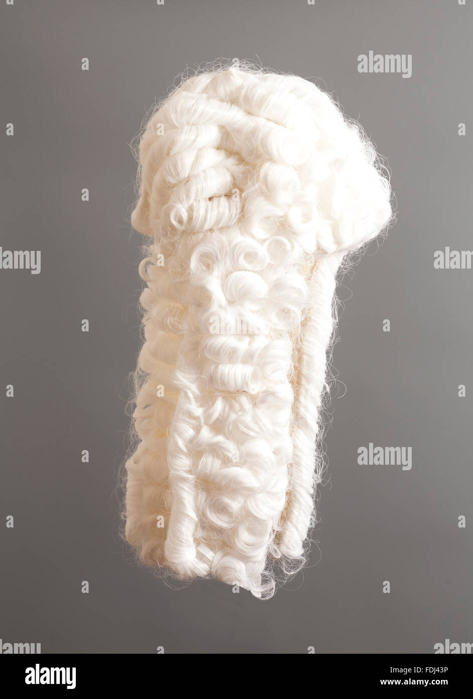 Judge wig on gray background Stock Photo - Alamy