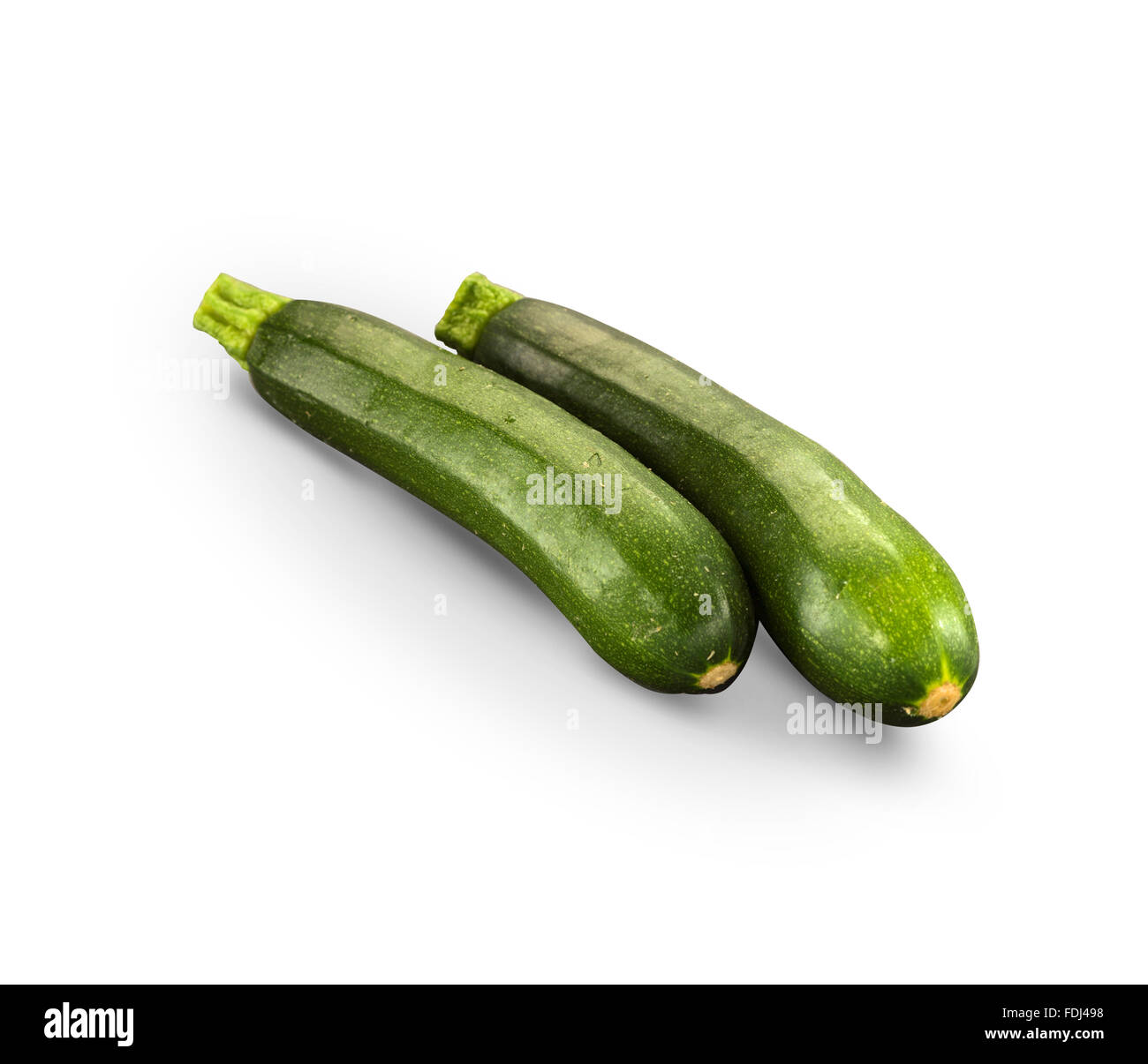 Organic Courgettes isolated on white background Stock Photo - Alamy
