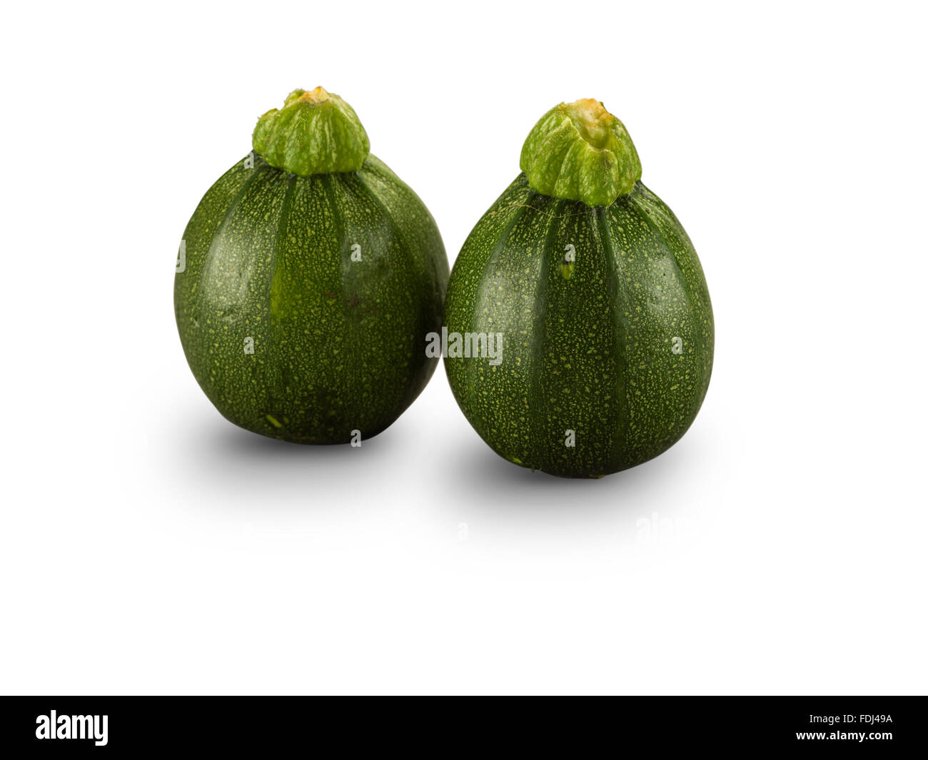 Organic Courgettes isolated on white background Stock Photo - Alamy