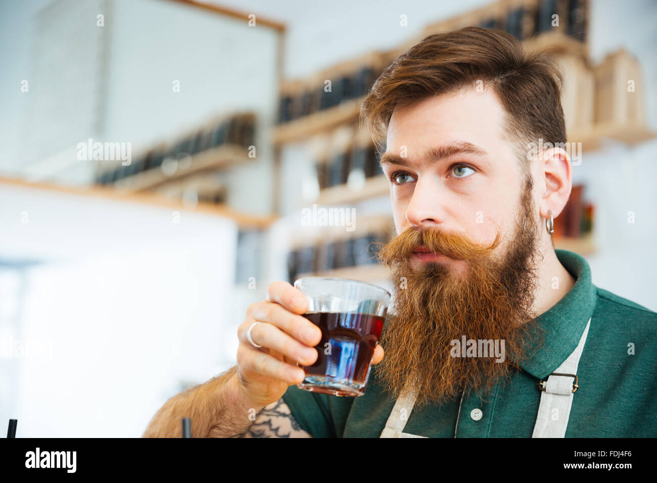 Handsome man drinking coffee Stock Photo - Alamy