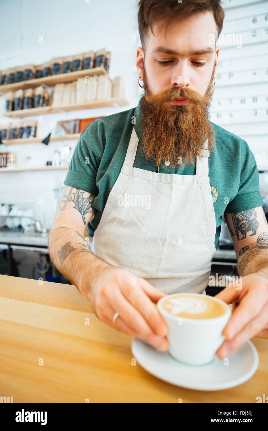 Handsome man preparing coffee in coffee shop Stock Photo - Alamy