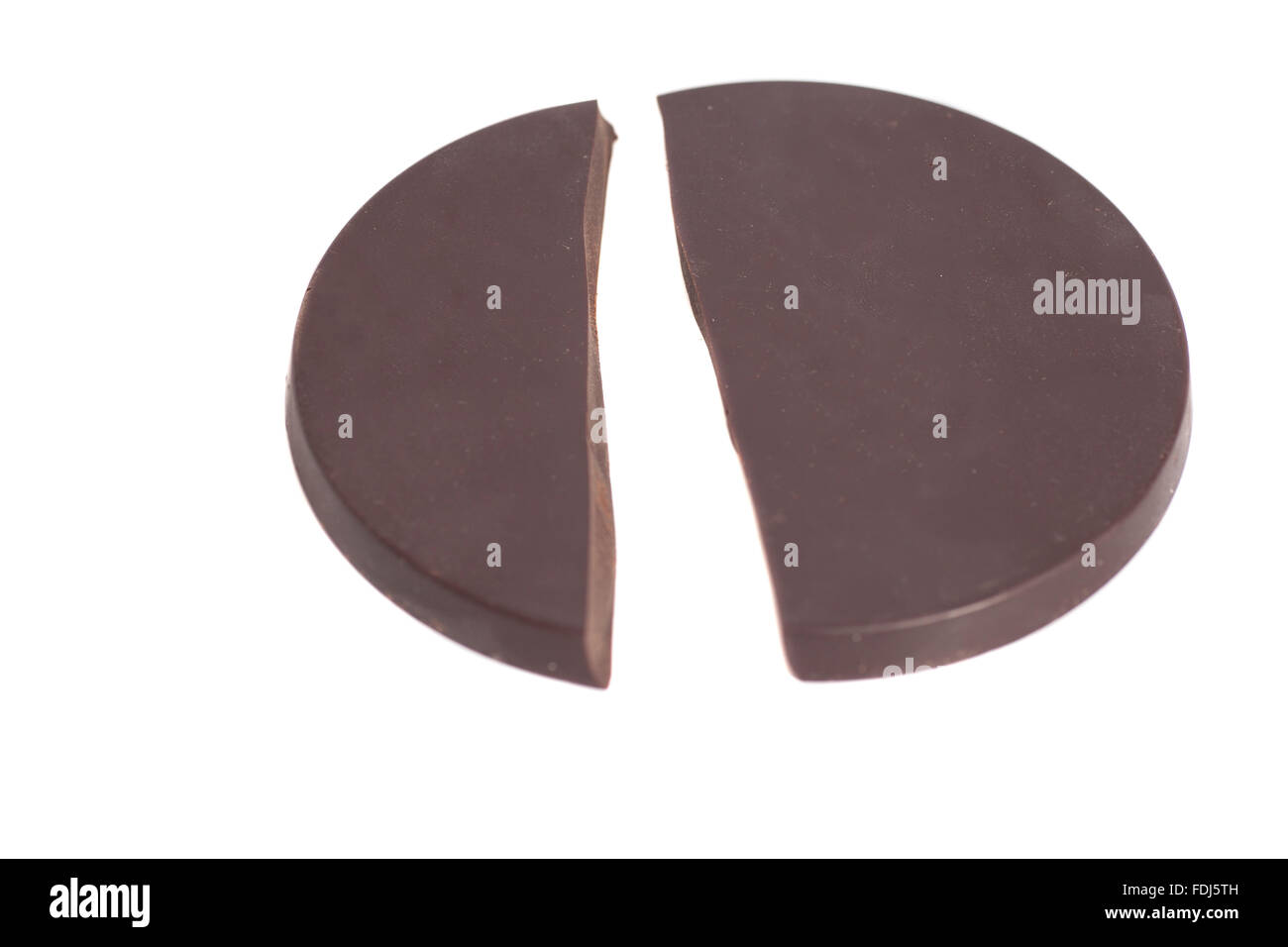 Broken round chocolate bar isolated on white background Stock Photo - Alamy