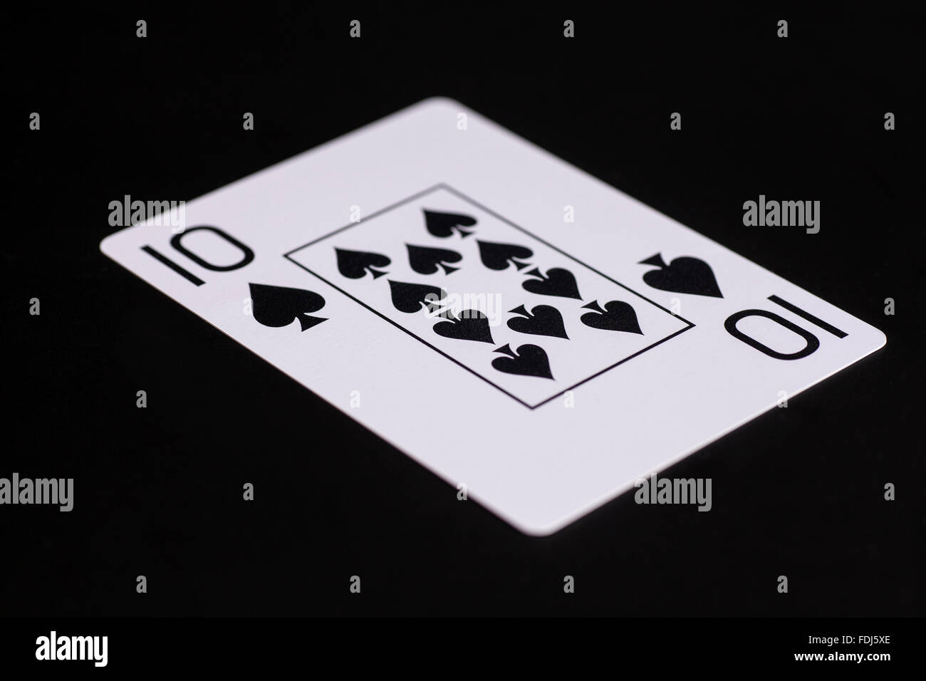 Ten of spades playing card on black background Stock Photo - Alamy
