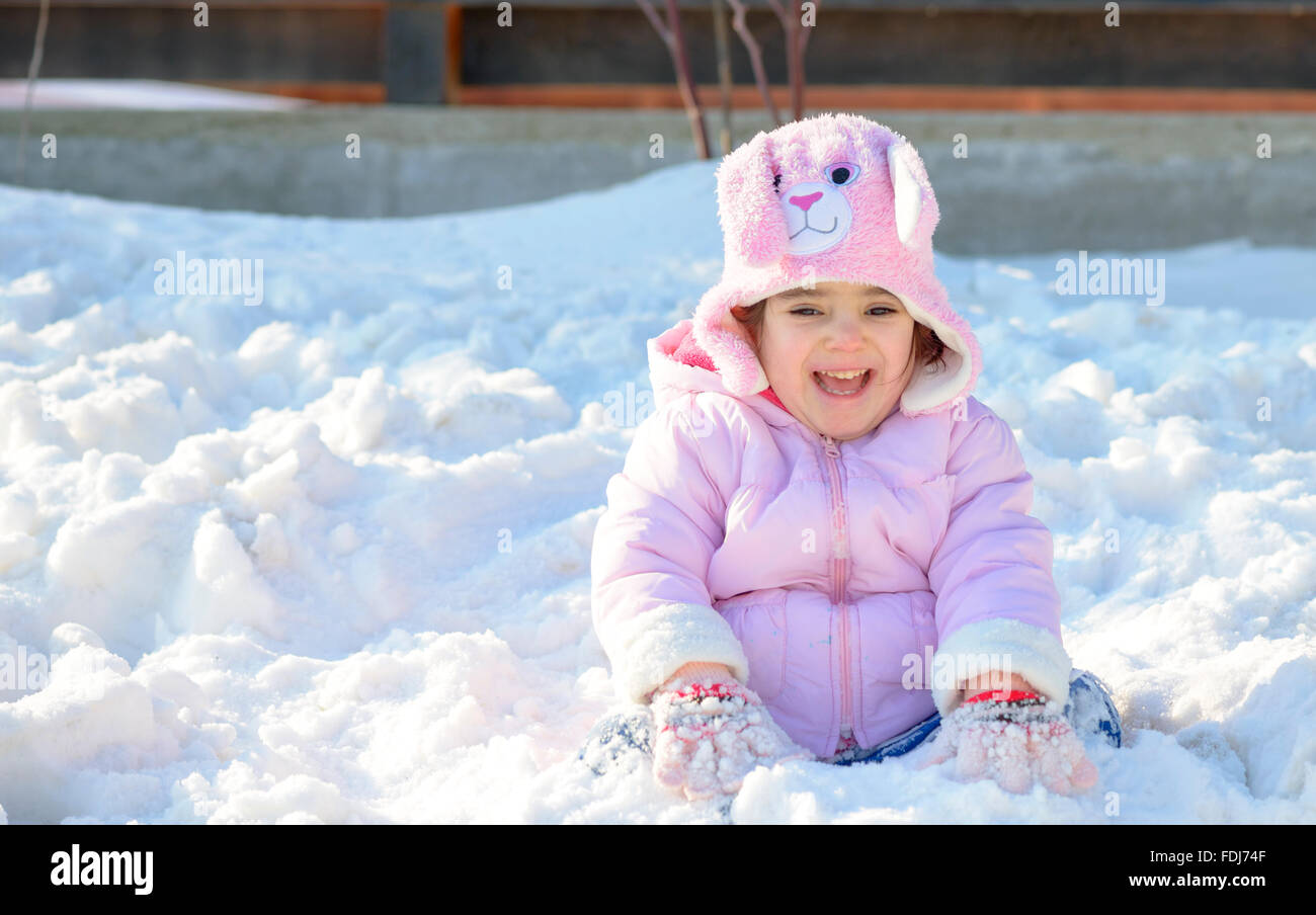 Little girl in snow Stock Photo - Alamy
