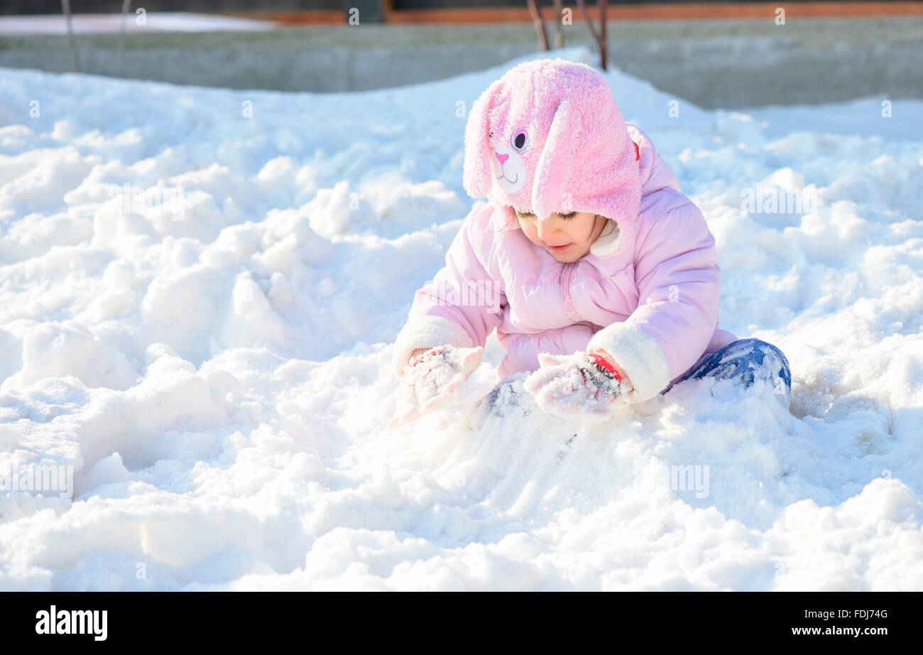 Little girl in snow Stock Photo - Alamy