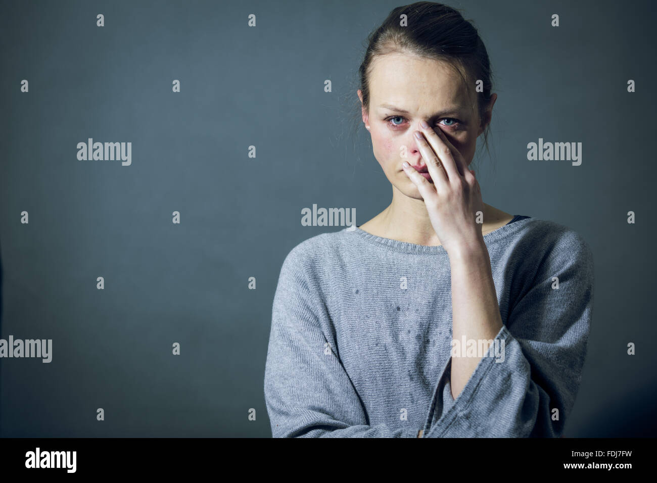 Young woman suffering from severe depression/anxiety/sadness, crying ...