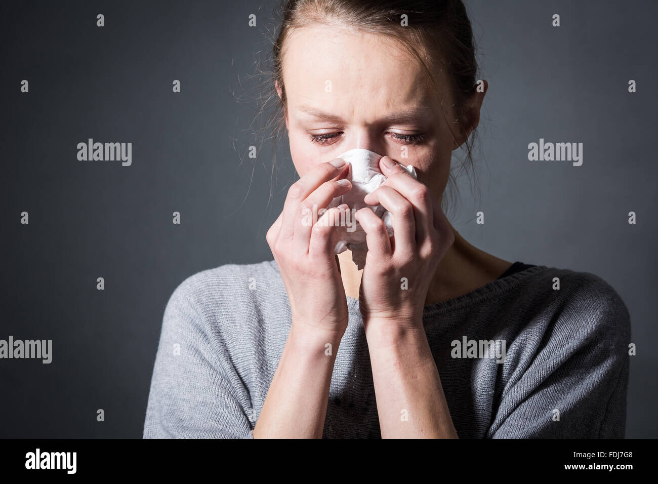 Young woman suffering from severe depression/anxiety/sadness, crying ...