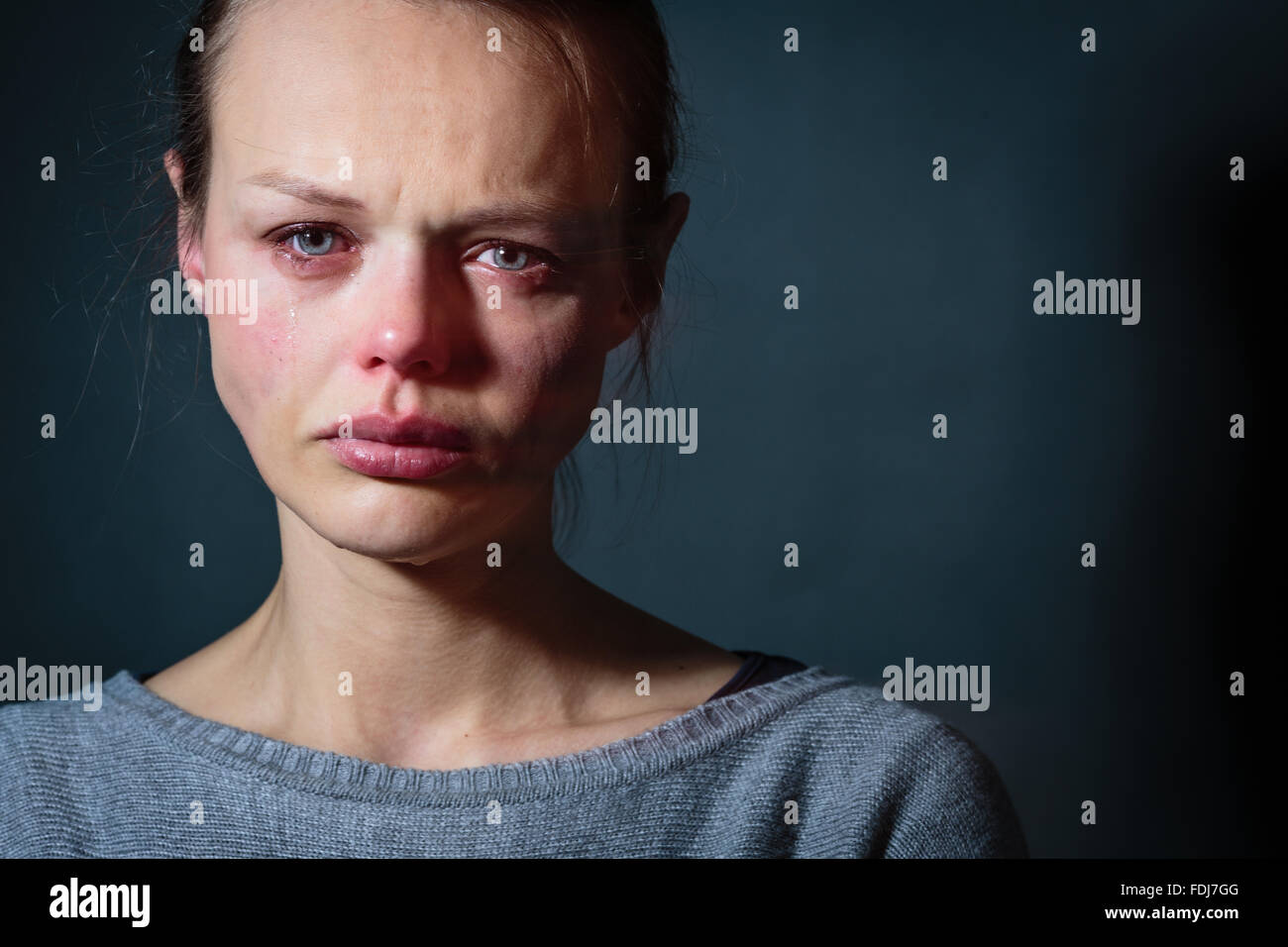 Young woman suffering from severe depression/anxiety/sadness, crying ...