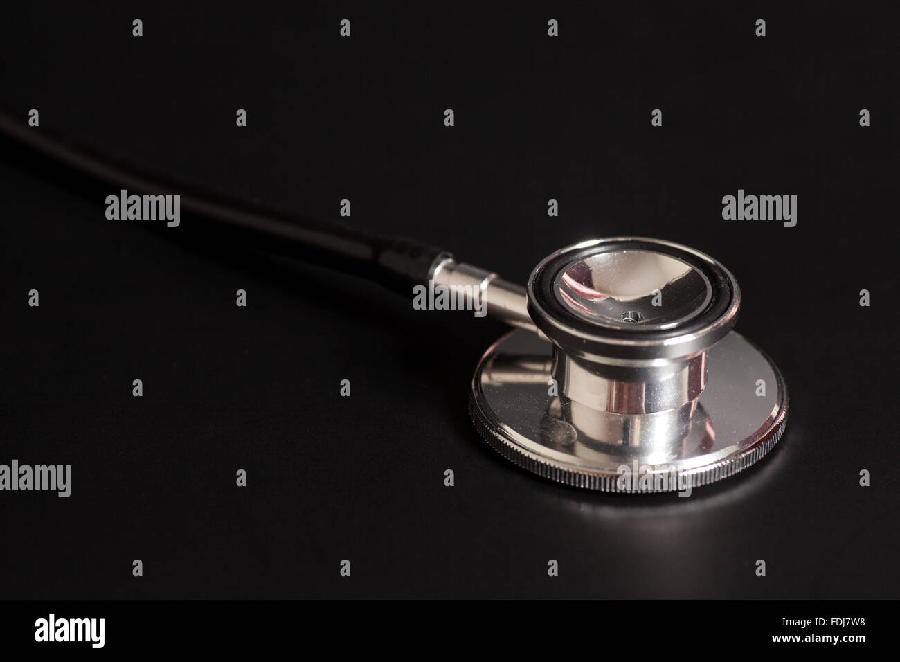 Doctor's stethoscope on black background Stock Photo - Alamy