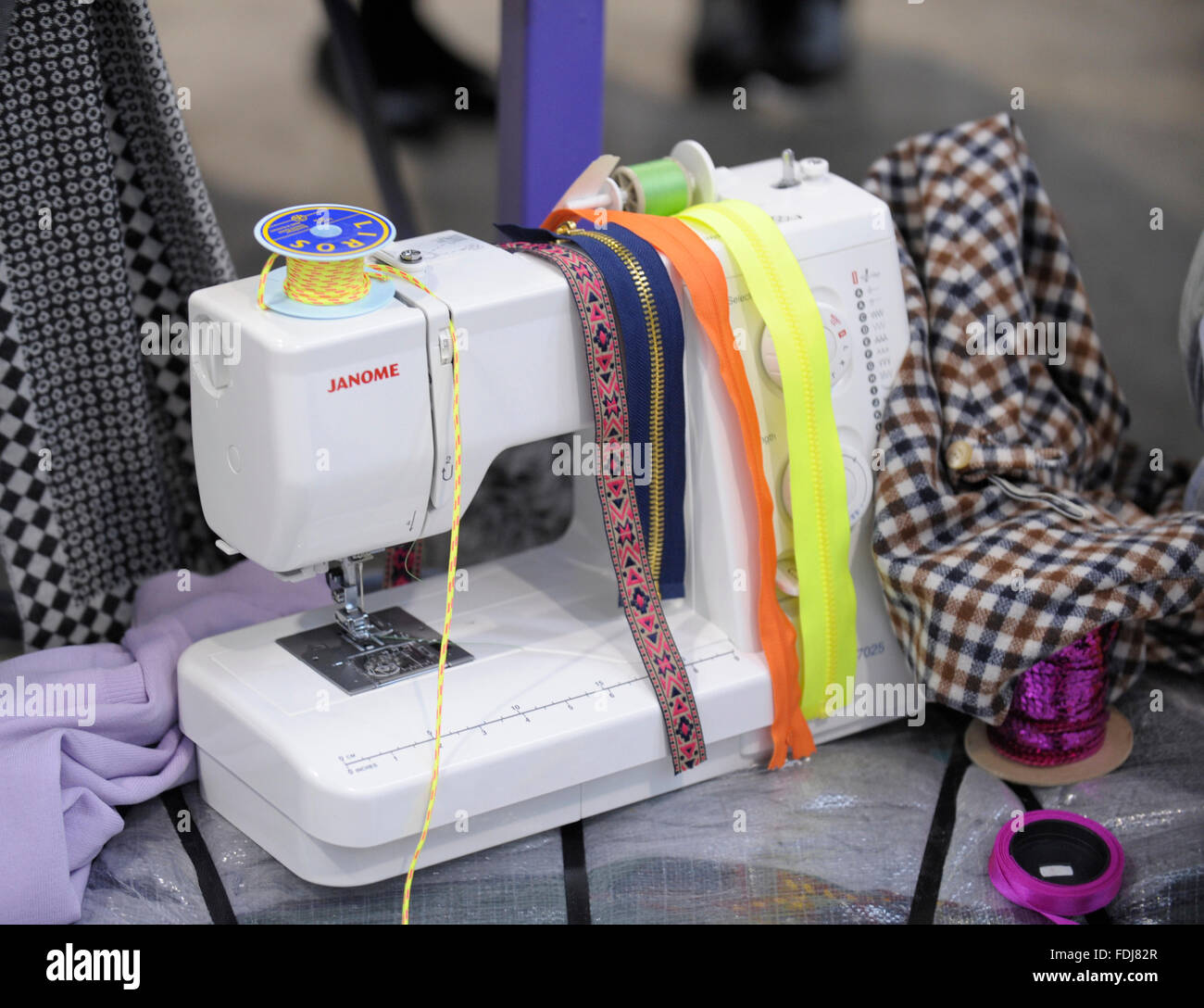 Electric sewing machine with fabric Stock Photo - Alamy