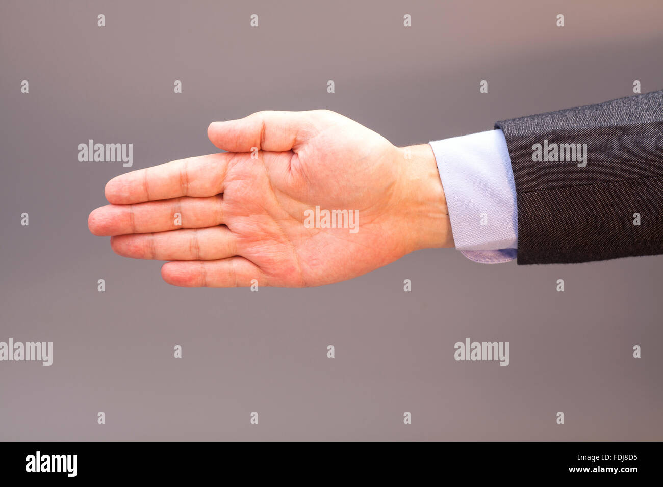 Man hand sign isolated on gray background Stock Photo - Alamy