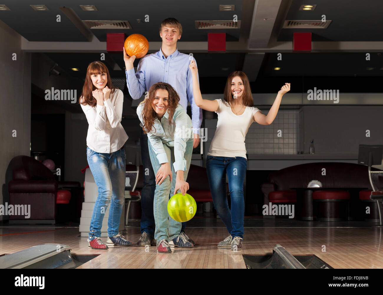 Happy group people bowling having hi-res stock photography and images ...