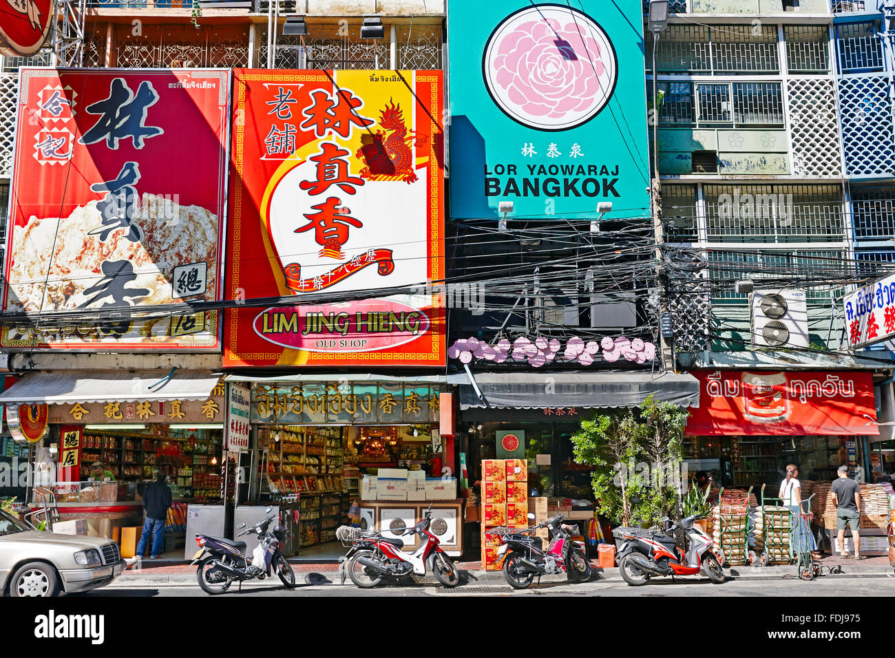 Sunlit colorful advertising billboards on buildings on the Yaowarat ...