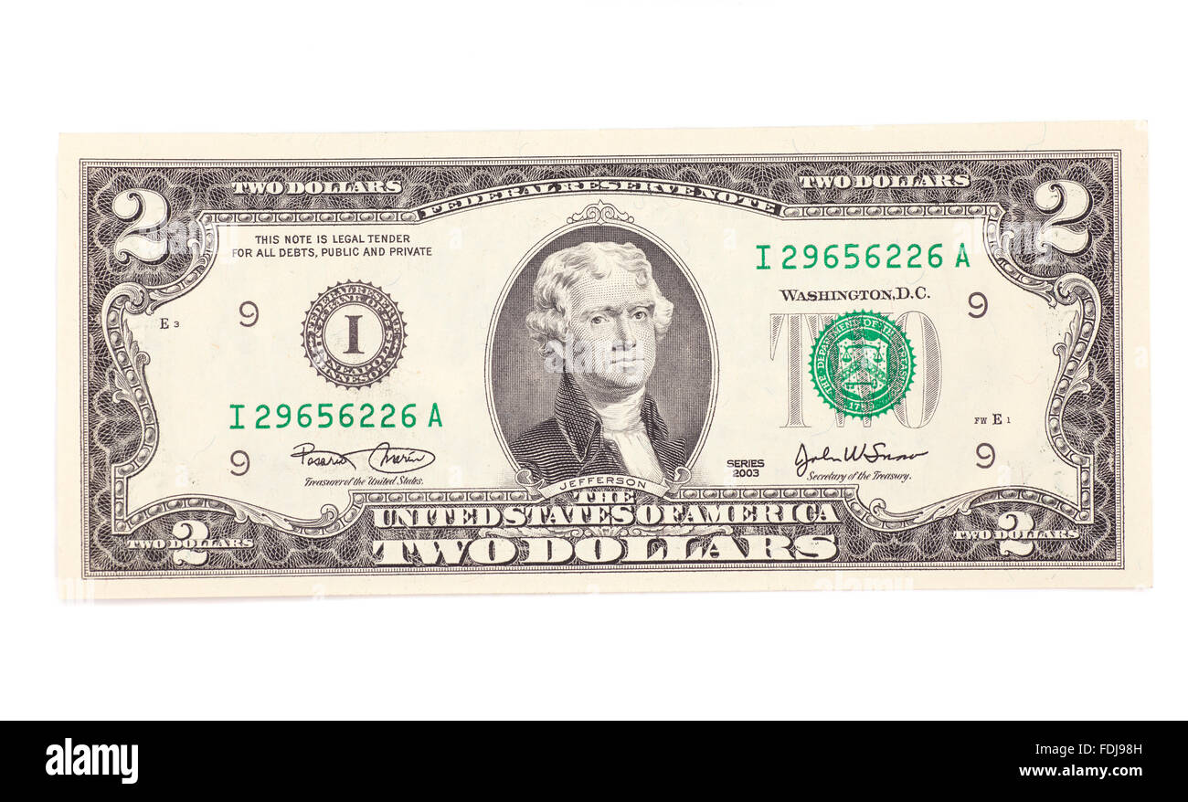 Two dollars bill on white background Stock Photo - Alamy