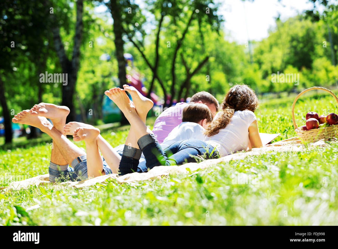 Happy family having weekend in summer park Stock Photo - Alamy