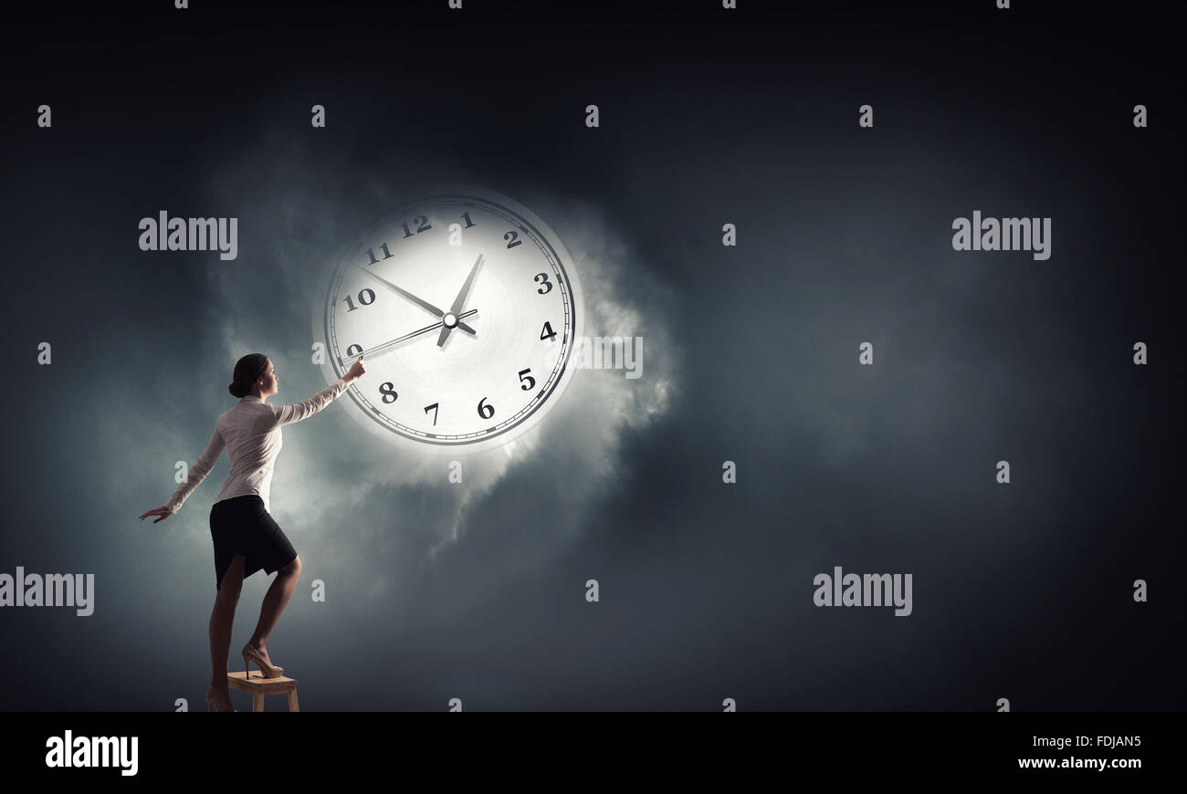 Female standing time passing hi-res stock photography and images - Alamy