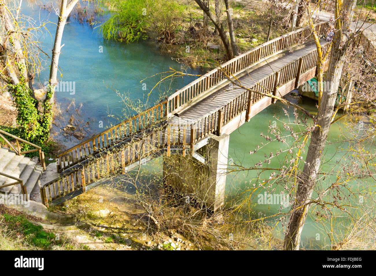 small wooden footbridge in a forest Stock Photo - Alamy