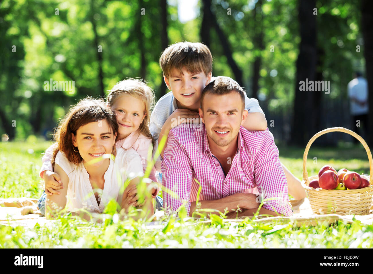 Happy family having weekend in summer park Stock Photo - Alamy
